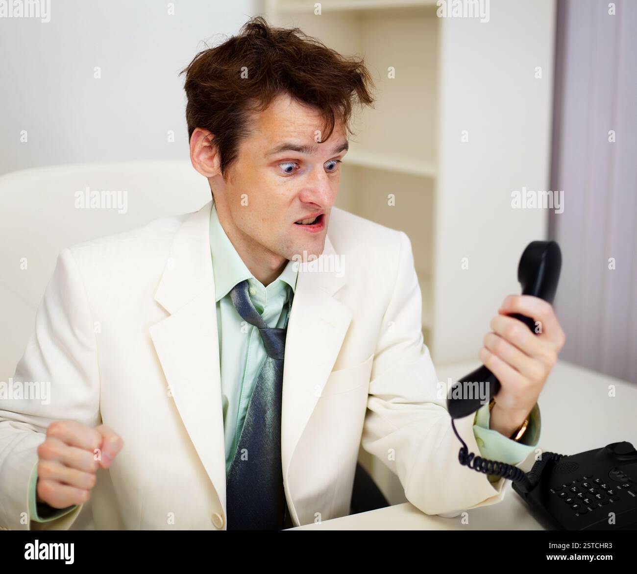Very angry businessman in office Stock Photo - Alamy