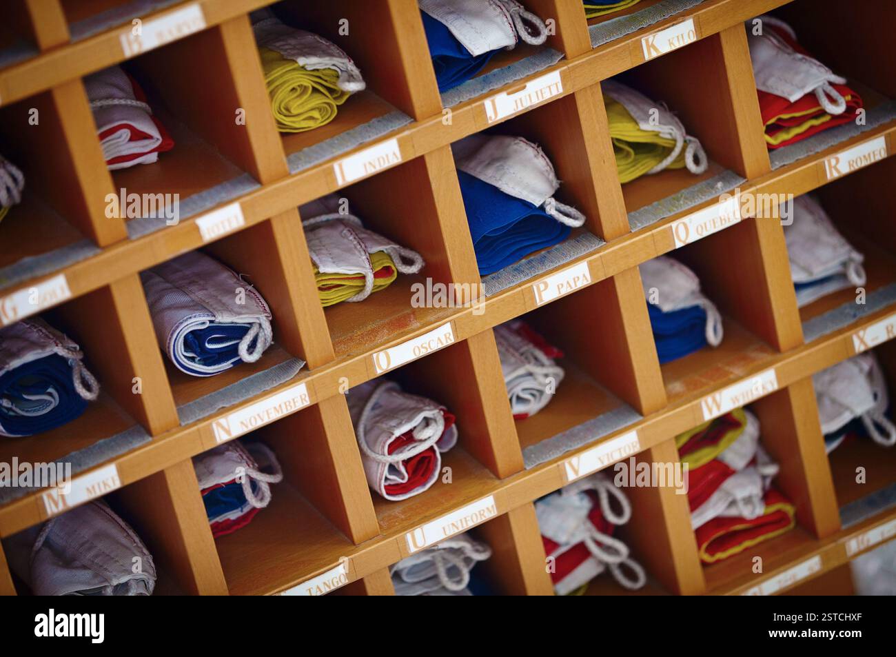 Marine sea signal flags in wooden cupboard Stock Photo - Alamy