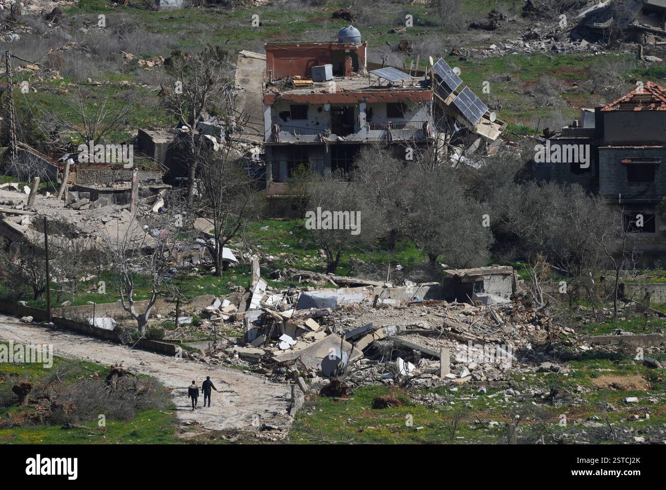Lebanese citizens check the destruction in their village caused by the ...