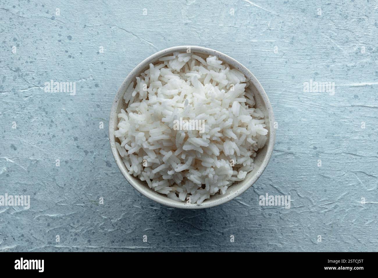 White rice, cooked. A bowl of boiled long grain rice, a simple side ...