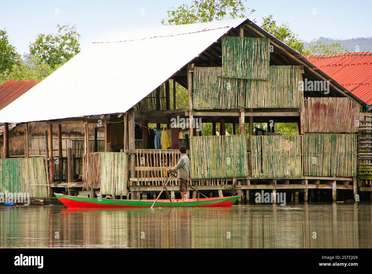 Local man rowing through water village, Ream Natio Stock Photo - Alamy