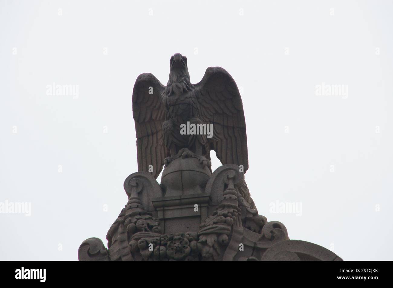 Boston Sculpture. Black eagle perched atop a globe, wings spread ...