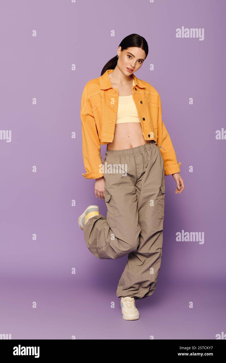 A young woman showcases her fashion sense in an eye catching outfit ...