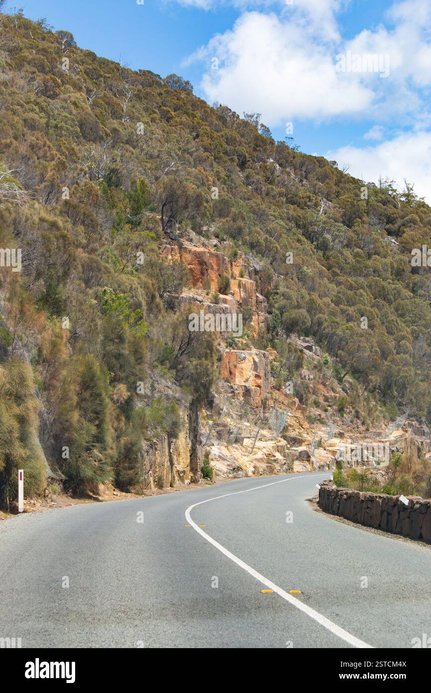 rock fall prevention metal net on two lane rural Tasman highway road on ...