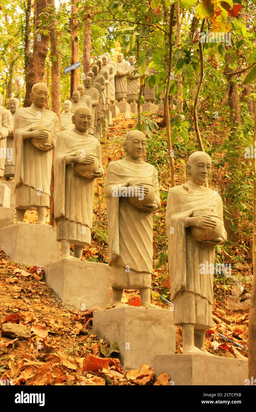 Statues of begging monks, Phnom Sombok, Kratie, Ca Stock Photo - Alamy