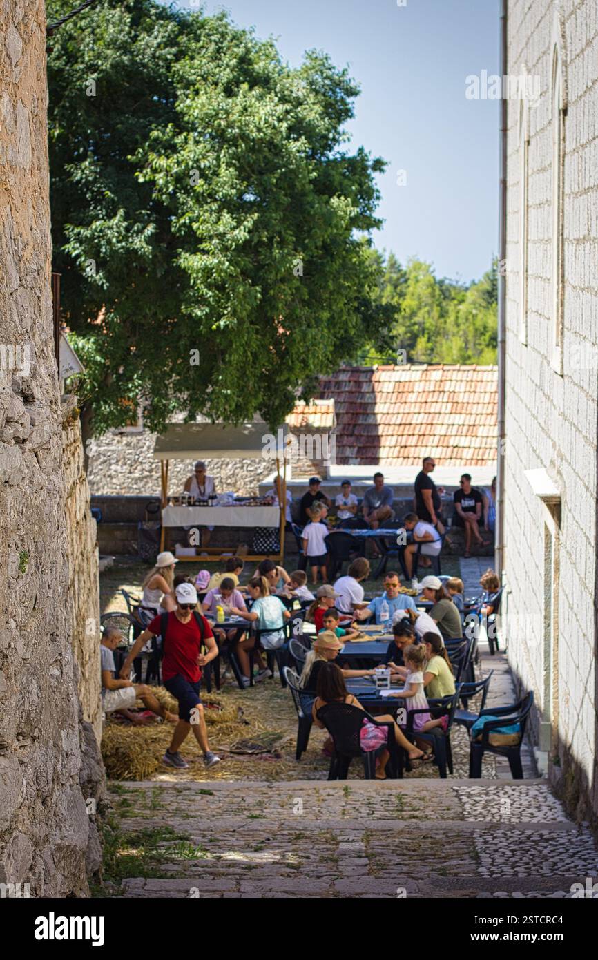 People crafting handmade items at the Lavender Festival in Velo Grablje ...