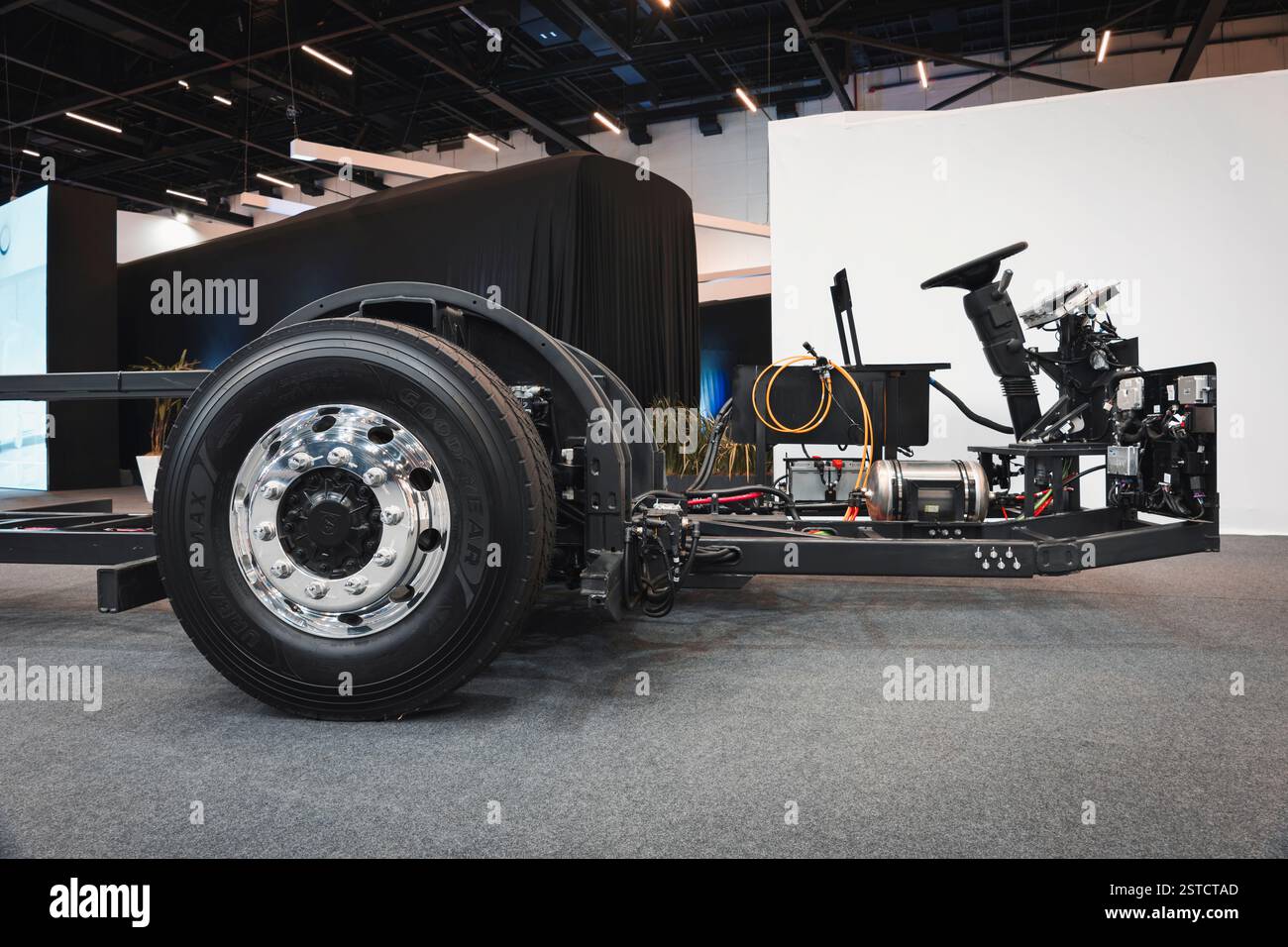 Image of an electric vehicle chassis on display at an event, with ...