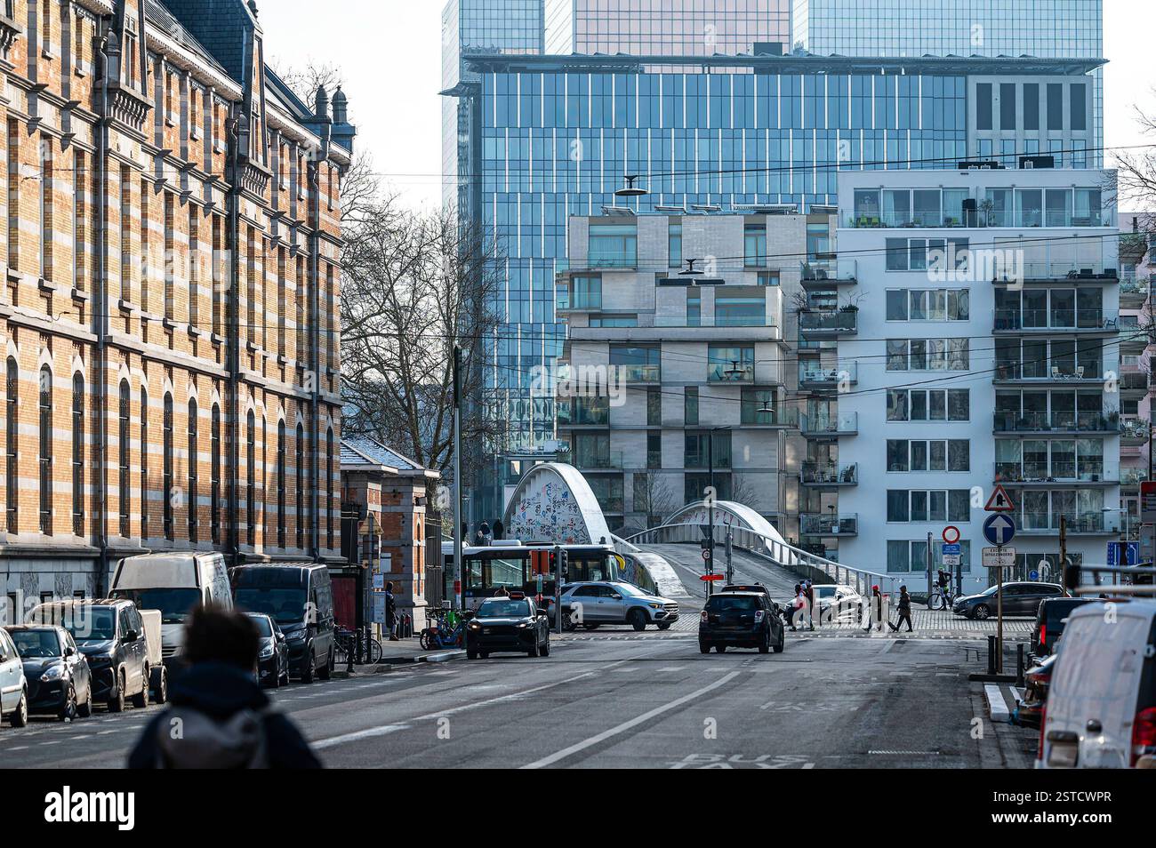 Mixed traffic with cars, busses, pedestrians and bikes at the rue ...