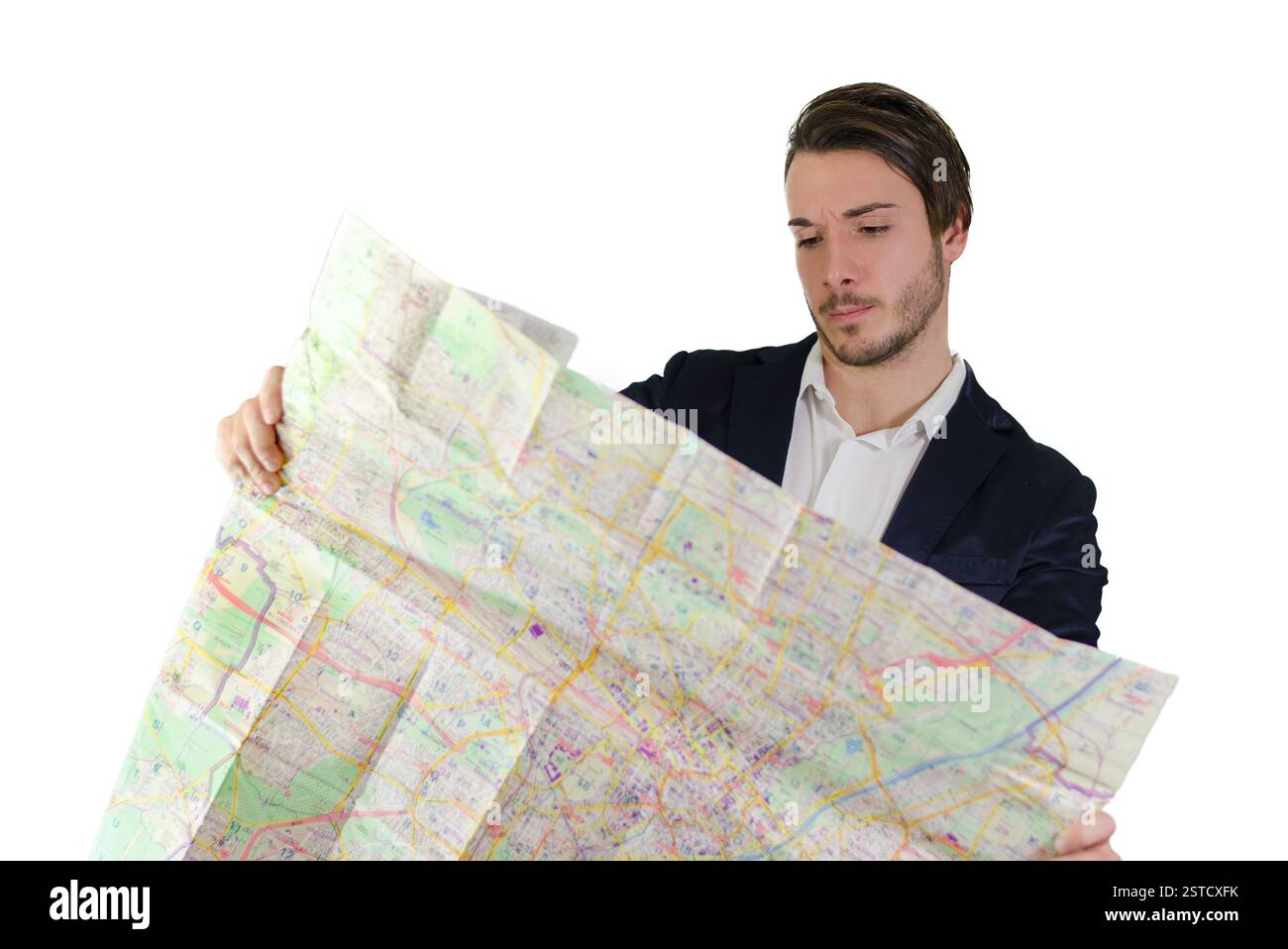 Young man looking at city map, confused or lost Stock Photo - Alamy