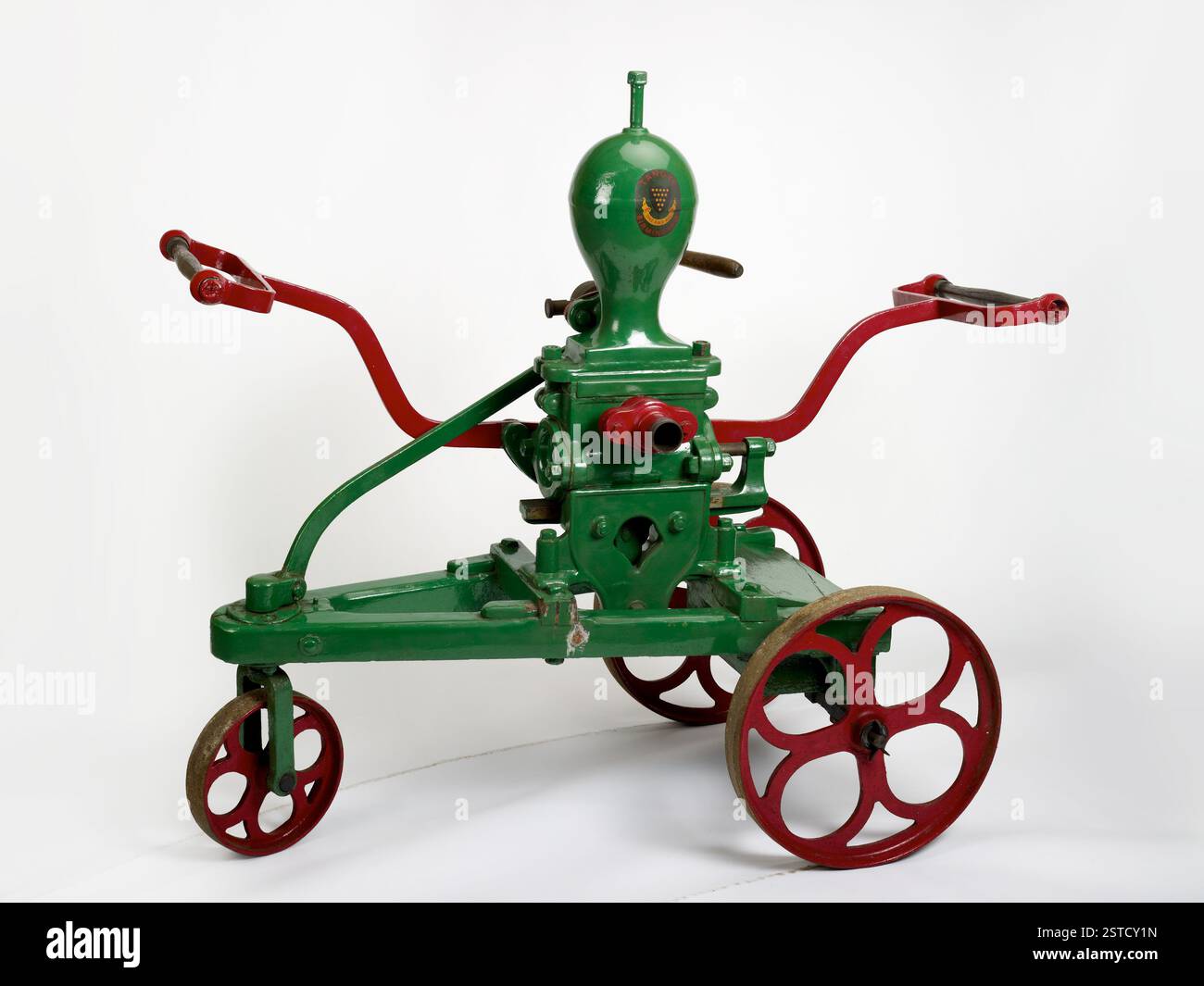 The Tangye fire pump with hose reel, crafted from painted steel, is a ...