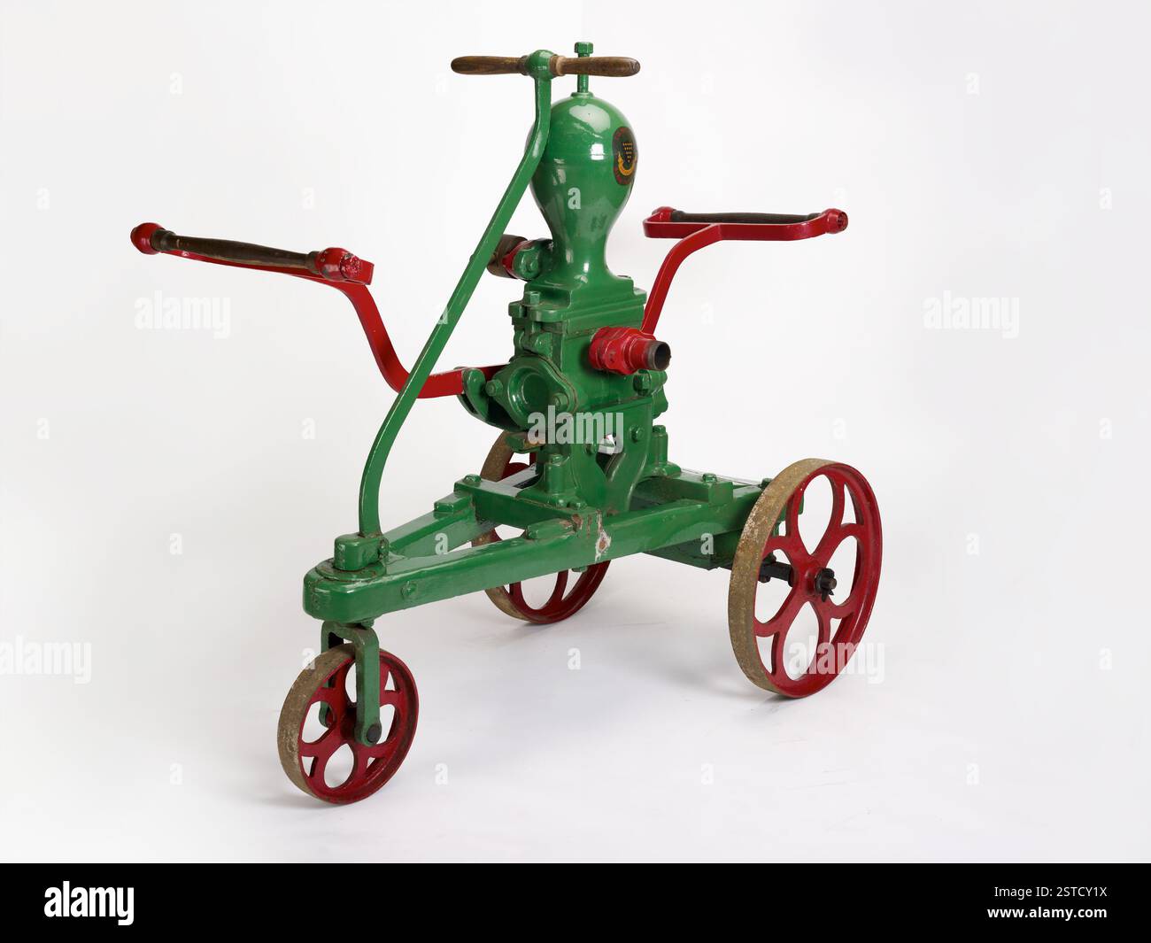 A vintage Tangye fire pump with a hose reel, crafted from painted steel ...