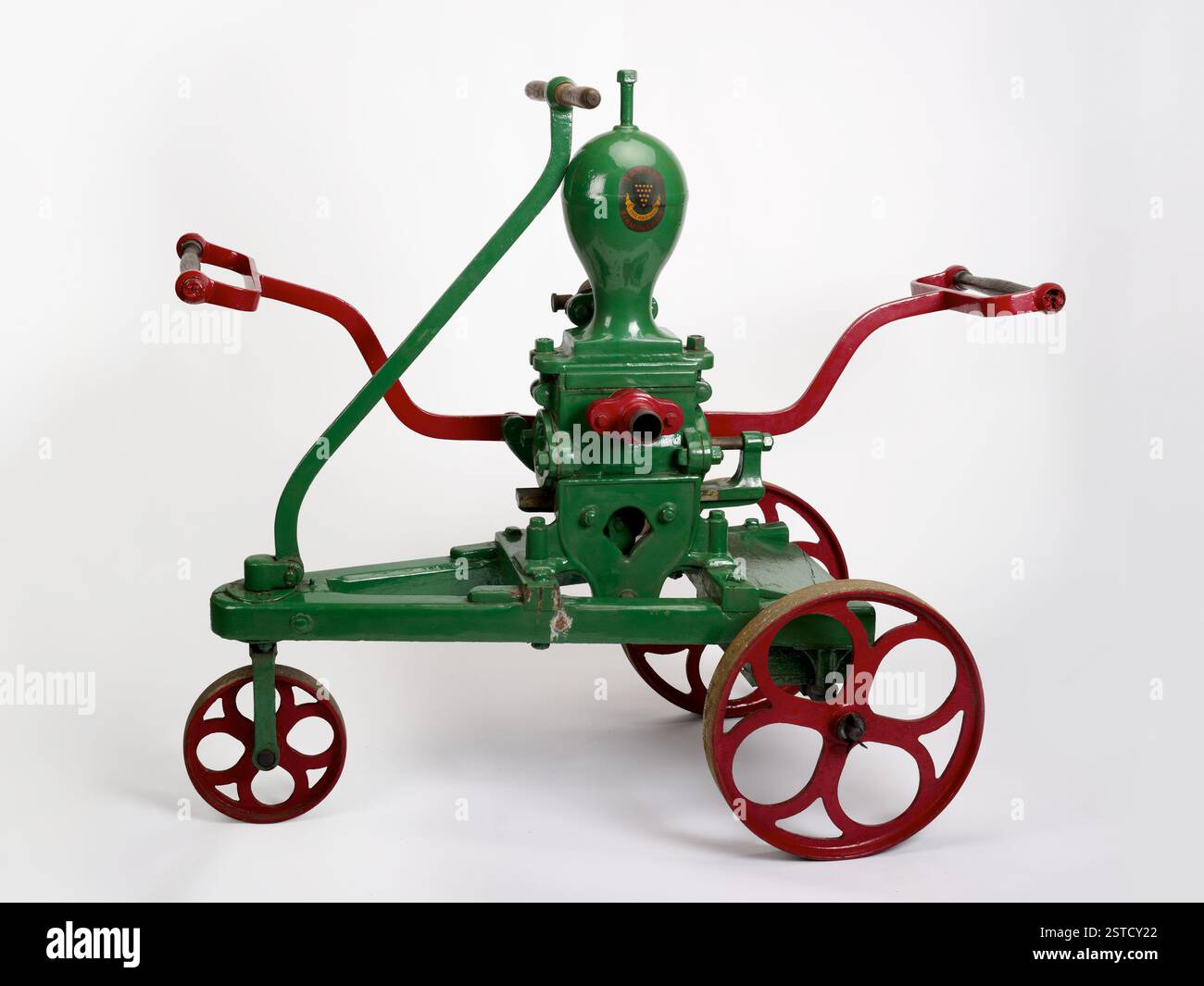 A Tangye fire pump with hose reel made from painted steel, produced by ...