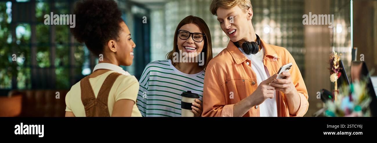 Three colleagues laugh and chat happily in the hotel lobby, enjoying ...