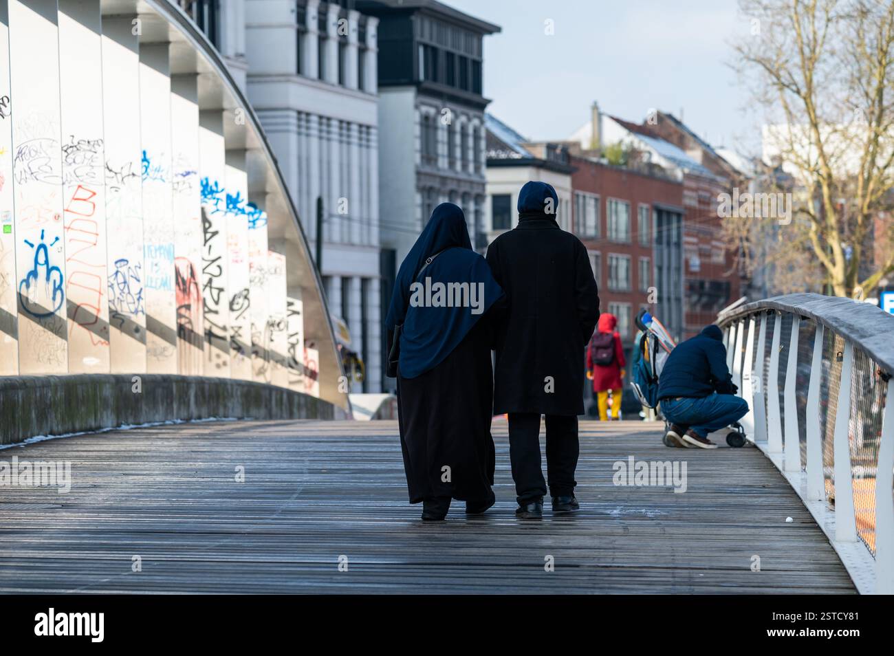 People walking over the Suzan Daniel bridge in Molenbeek, Brussels ...