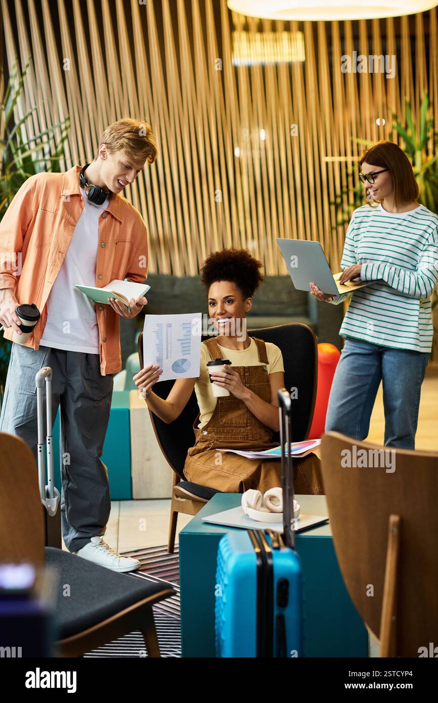 Three colleagues engage in a productive discussion at a hotel lounge ...