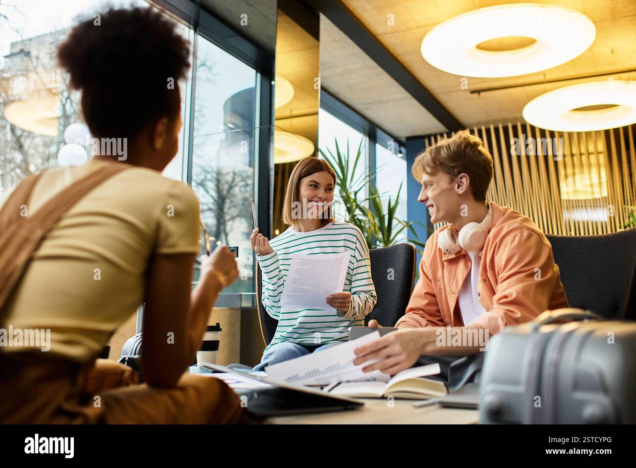 Team members engage in discussion while enjoying their time in a ...