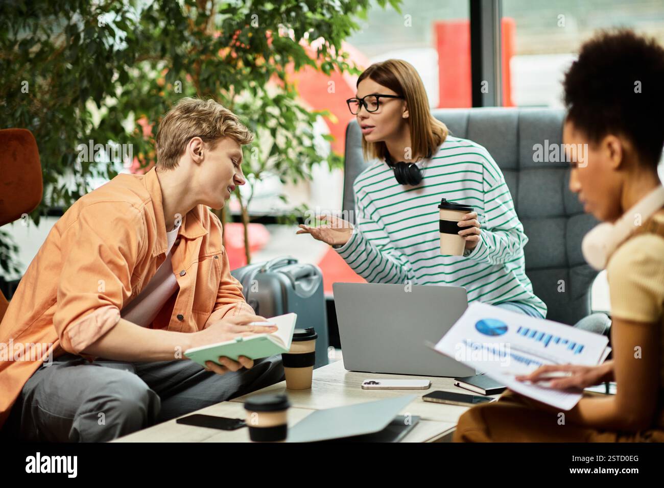 Groups of colleagues engage in a focused discussion while enjoying ...