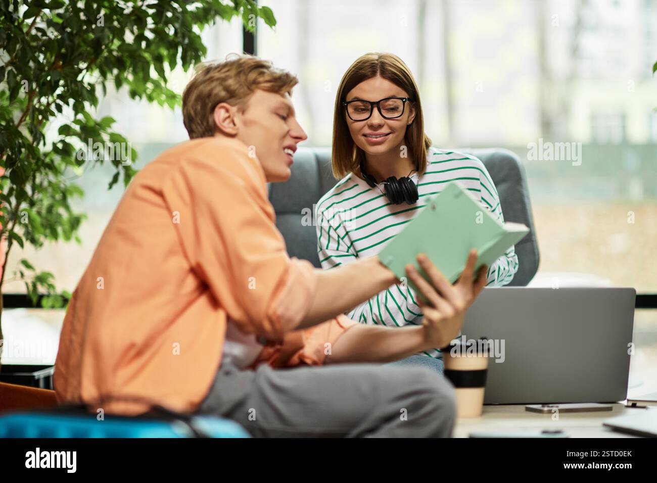 Colleagues share ideas and collaborate in a warm hotel setting ...