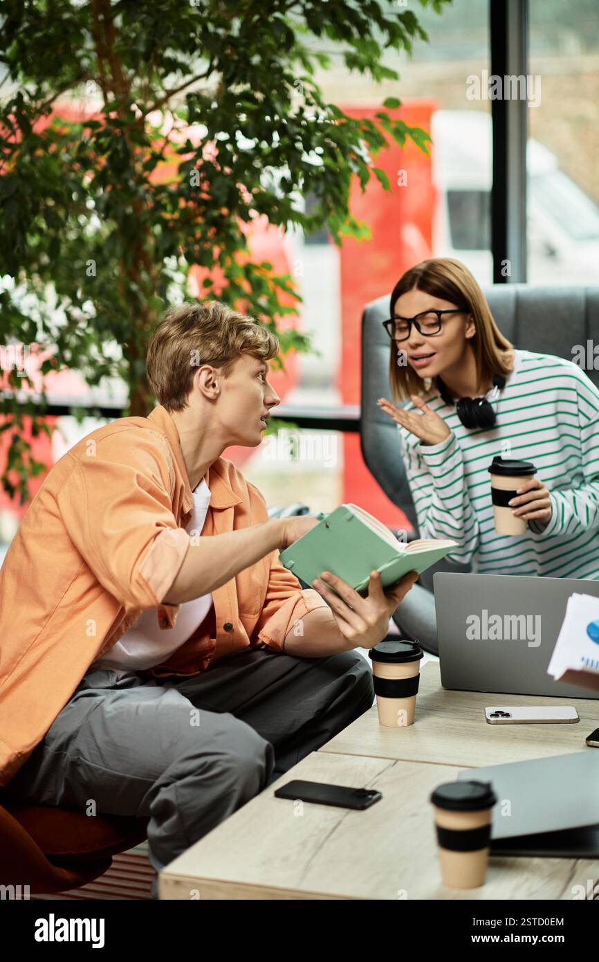 Two colleagues engage in a lively discussion while sharing ideas in a ...
