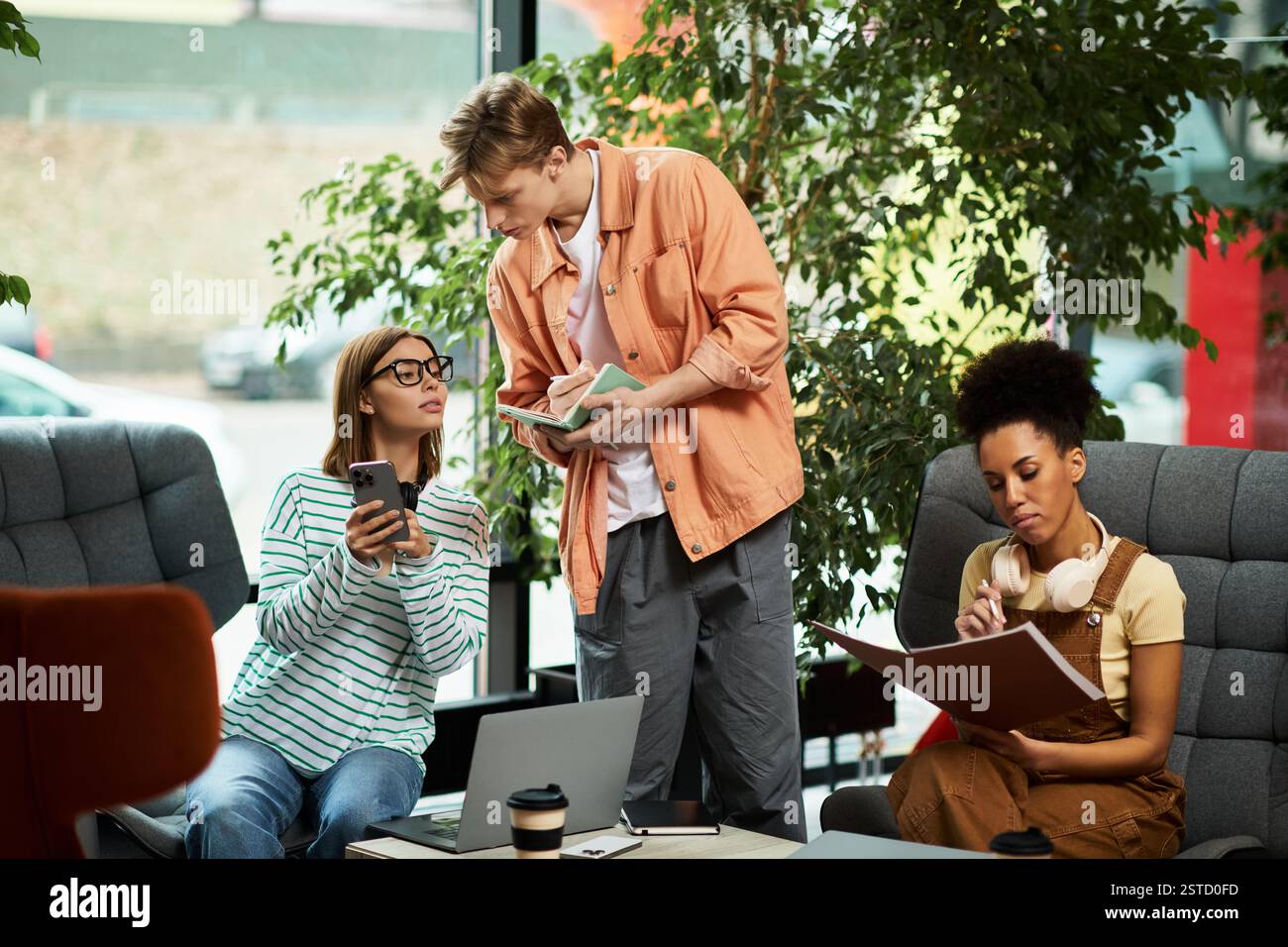 Team members engage in discussion and planning while relaxing in a ...