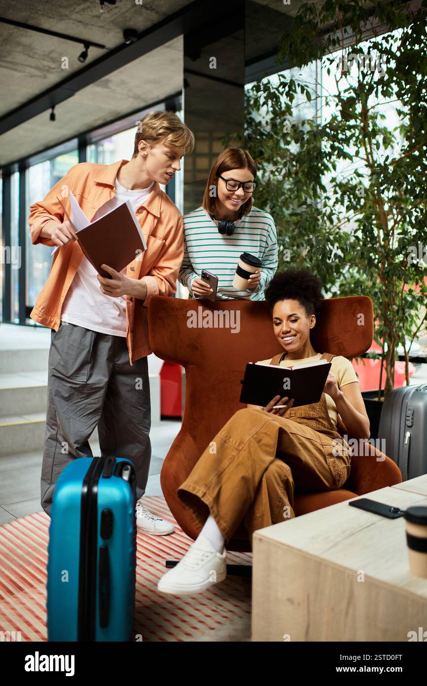 Three colleagues engage in discussions while enjoying drinks in a hotel ...