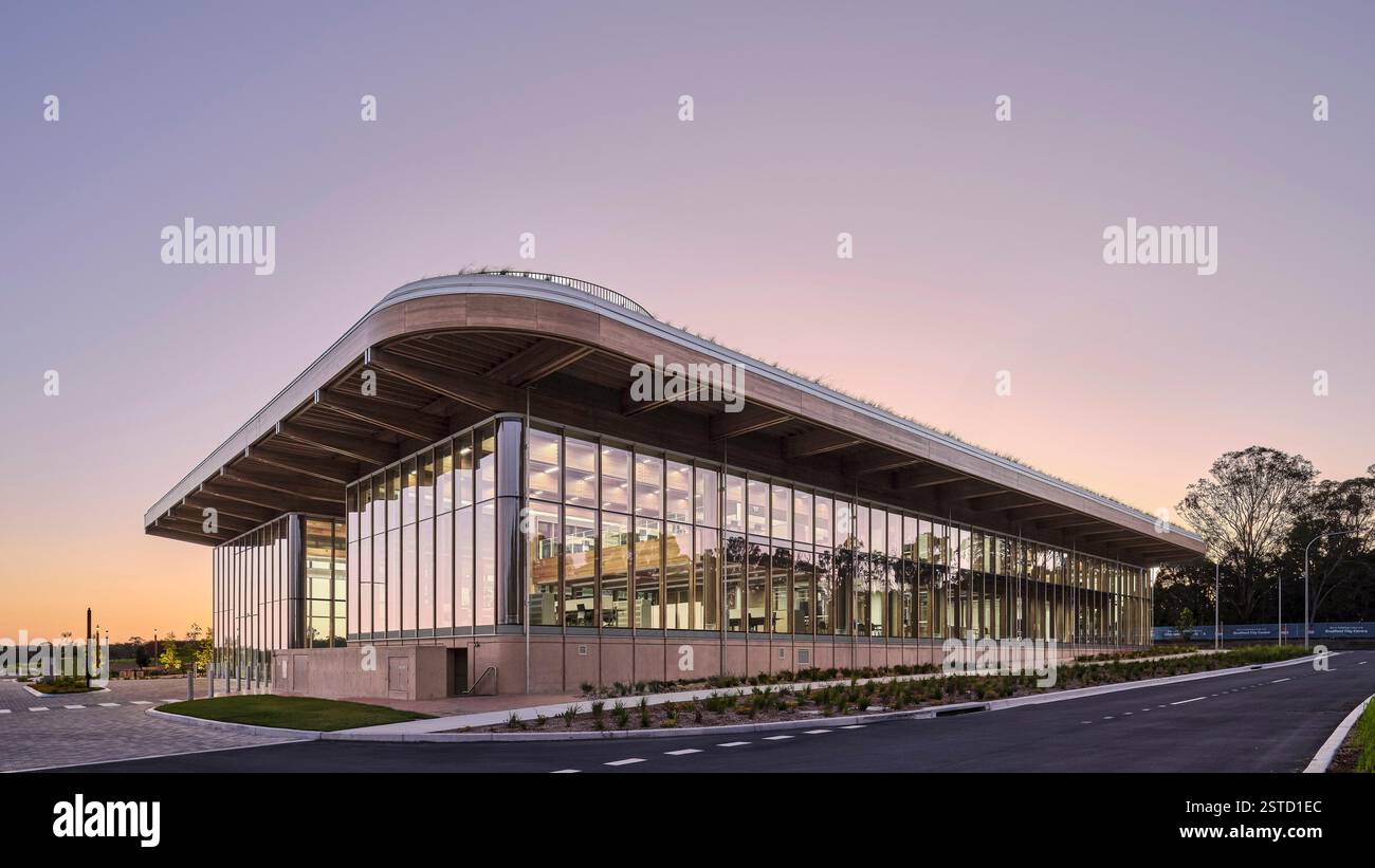 Whole building looking south west, corner elevation at dusk. Advanced ...