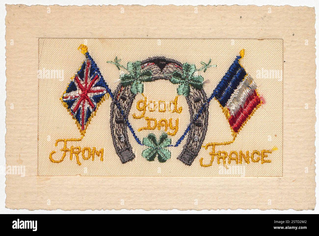 A symbolic arrangement featuring a horse iron, four-leaf clover, and ...