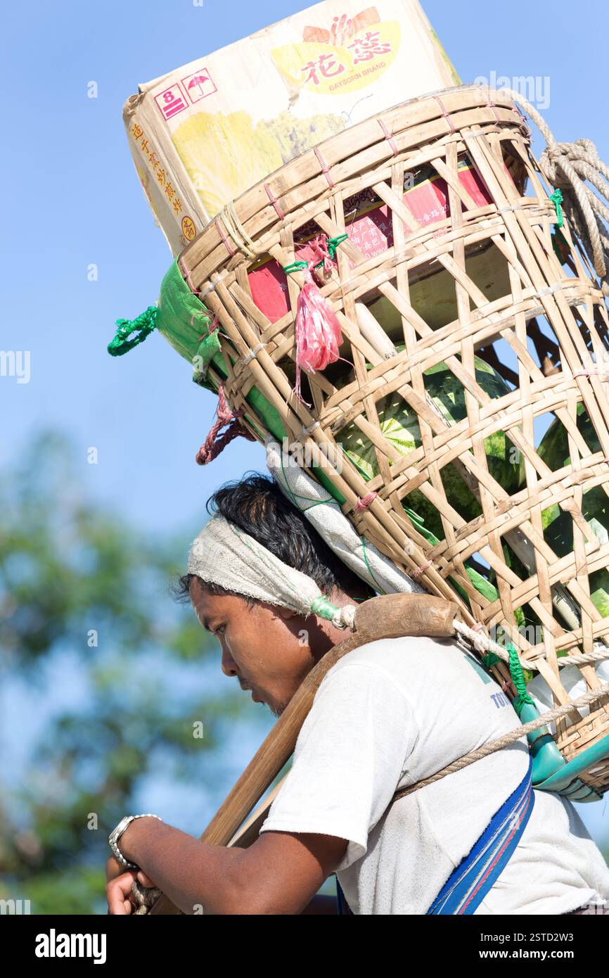 Myanmar, Kyaiktiyo Pagoda, Porters carrying goods to the Golden rock ...