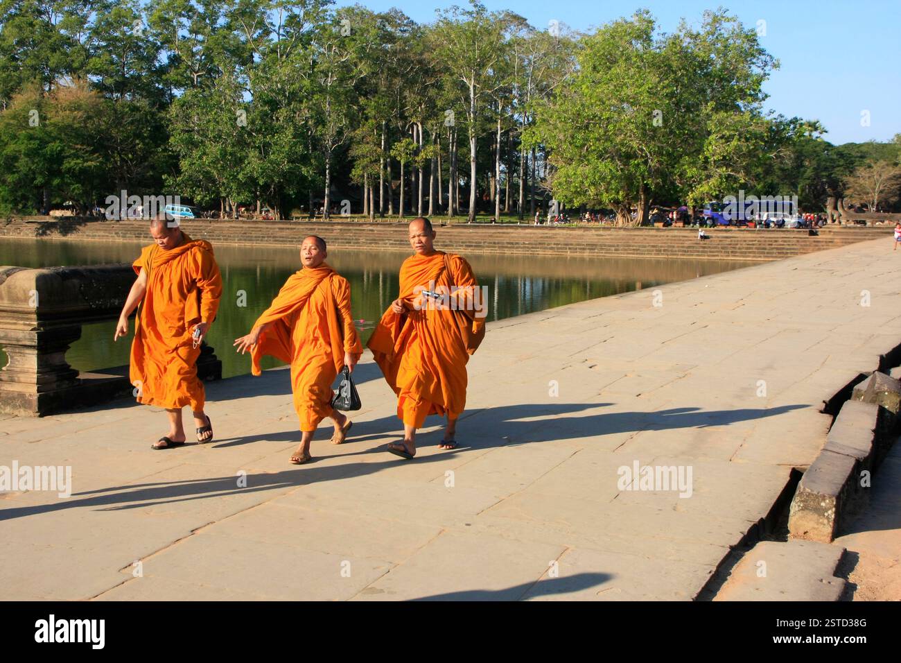 Monks walking into a temple, Angkor Wat Stock Photo - Alamy