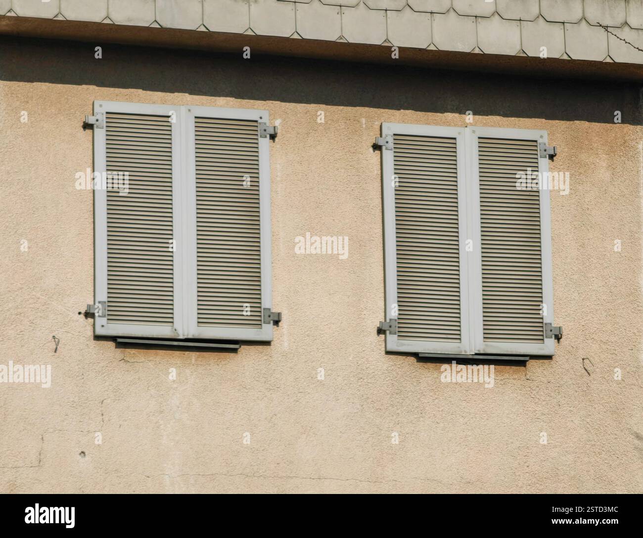 Urban Symmetry – Closed Window Frames with Blinds Stock Photo - Alamy