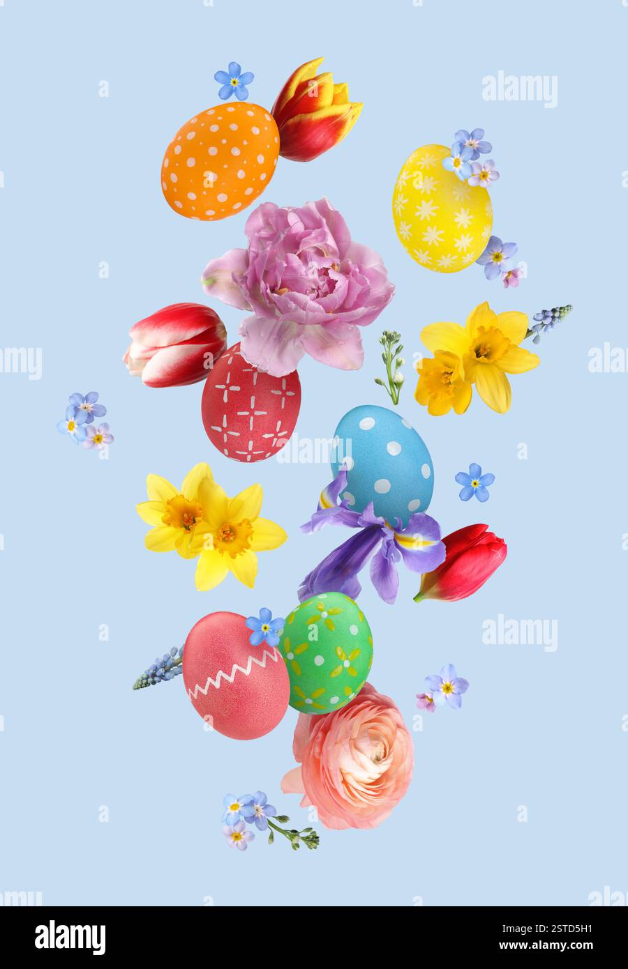 Easter eggs and beautiful spring flowers flying on pastel blue ...