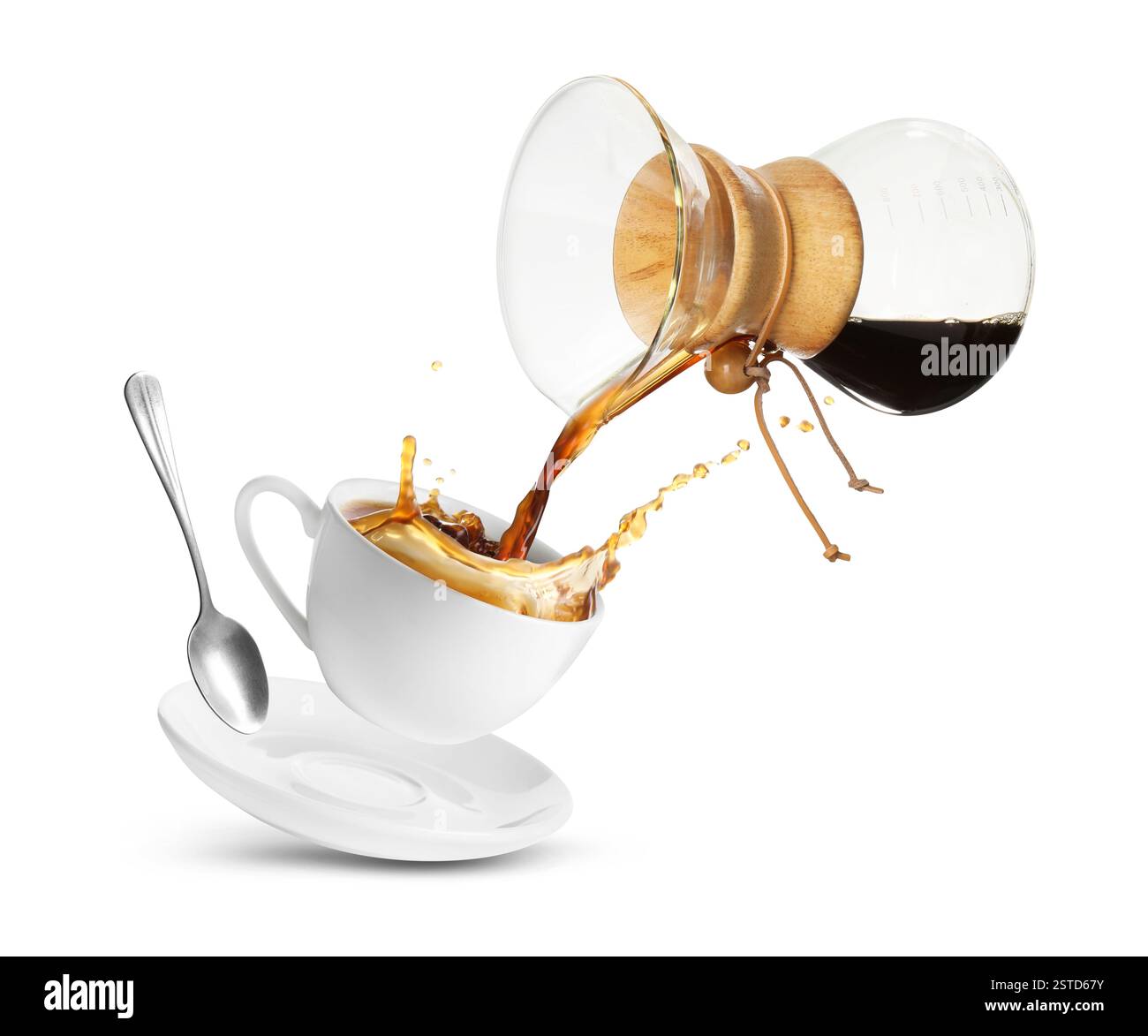 Pouring freshly brewed coffee from glass coffeemaker into cup on white ...