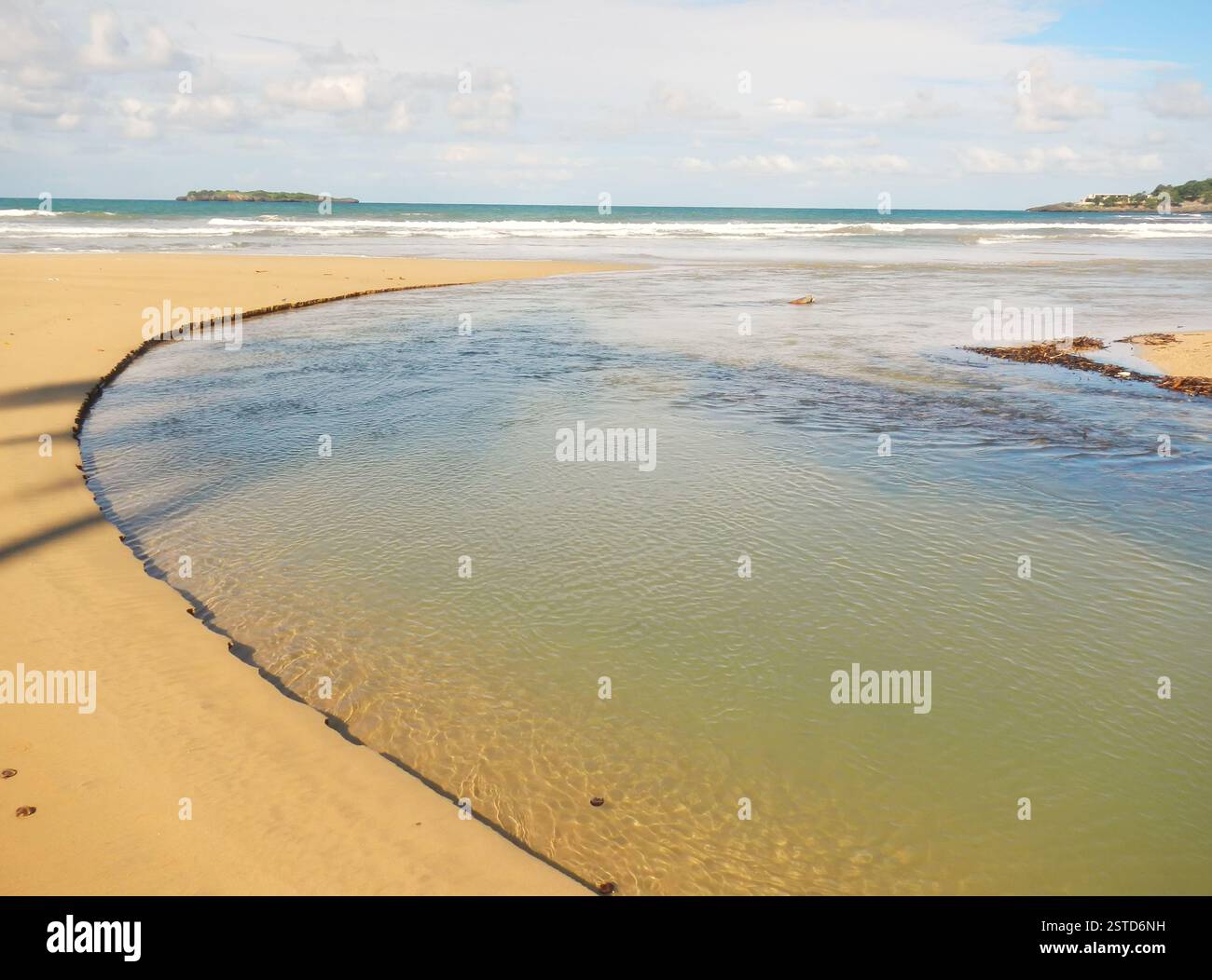 Freshwater river on a beach Stock Photo - Alamy