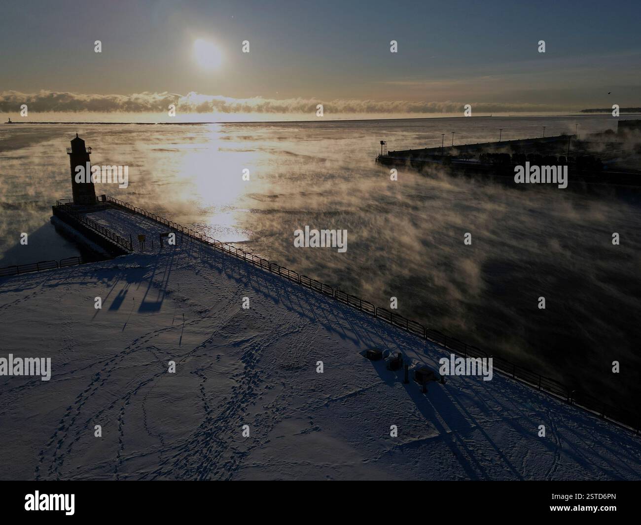 With temperatures below zero, steam rises over Lake Michigan Tuesday ...