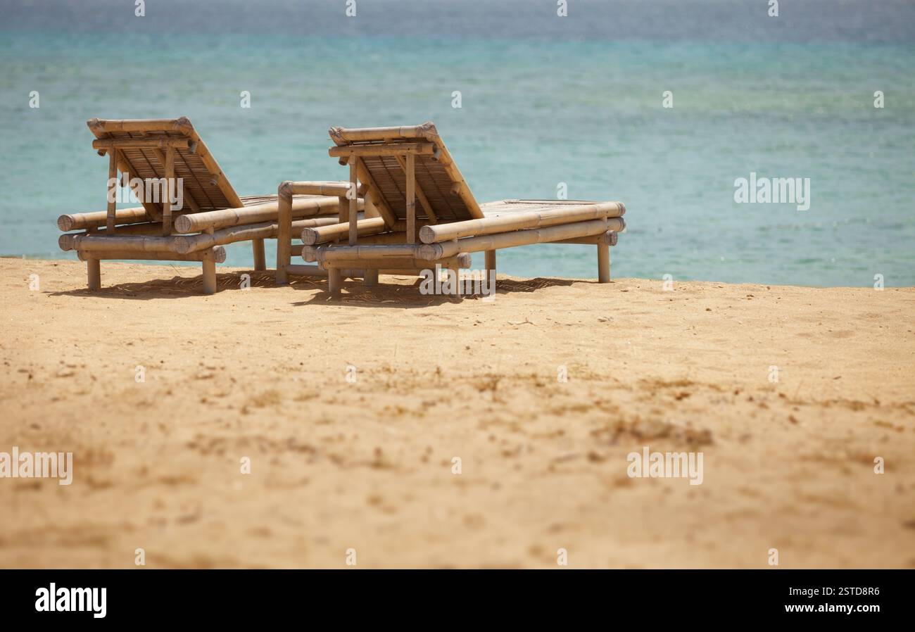Two bamboo deck chairs in retro style Stock Photo - Alamy