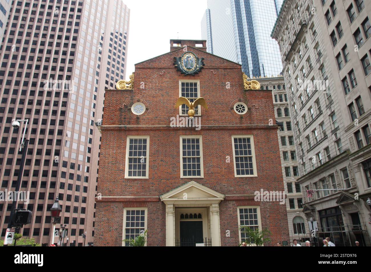 Old State House, a brick building adorned with a gold eagle, stands as ...