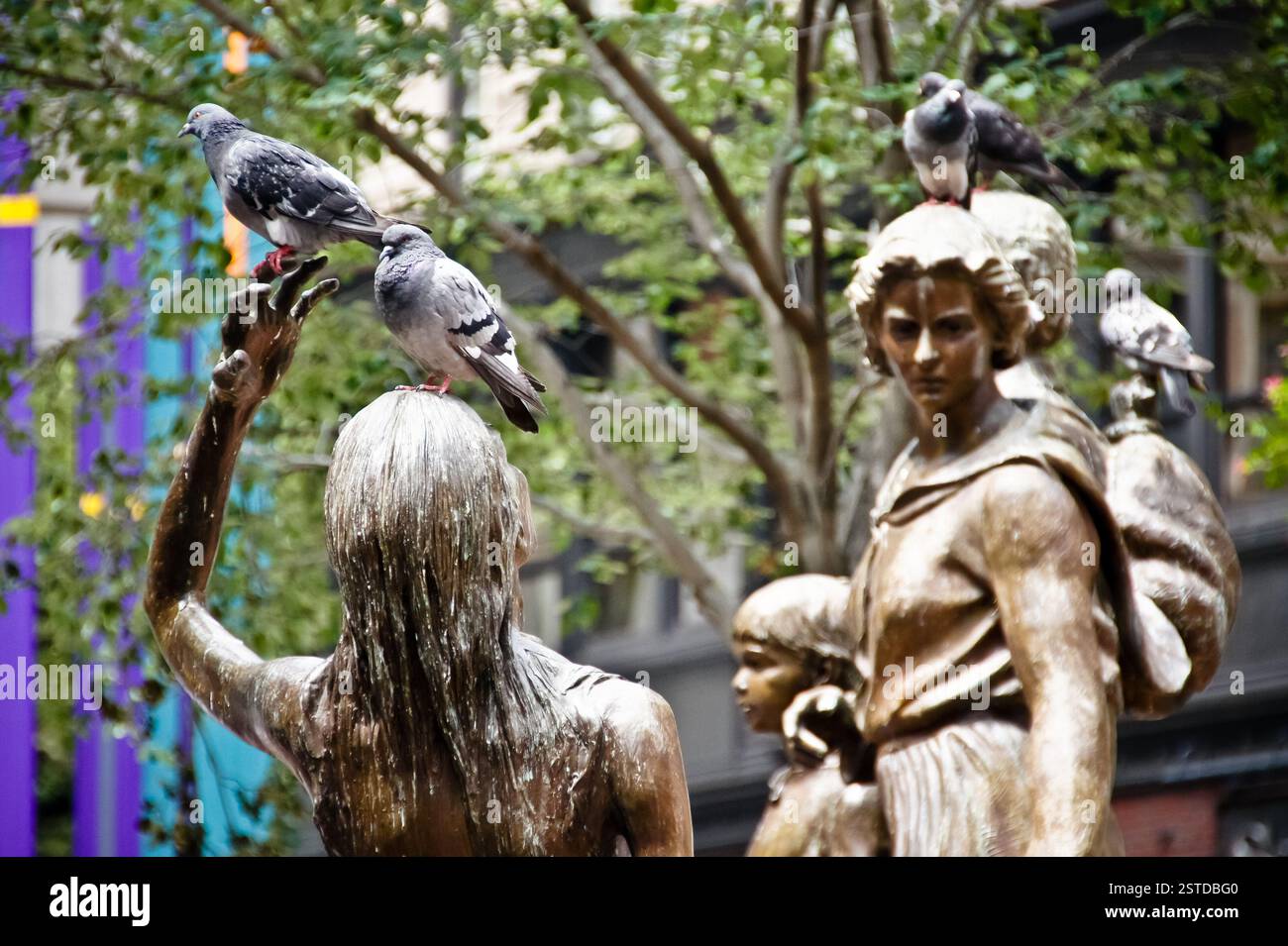 Boston: A bronze mother and children statue stands tall, its form ...