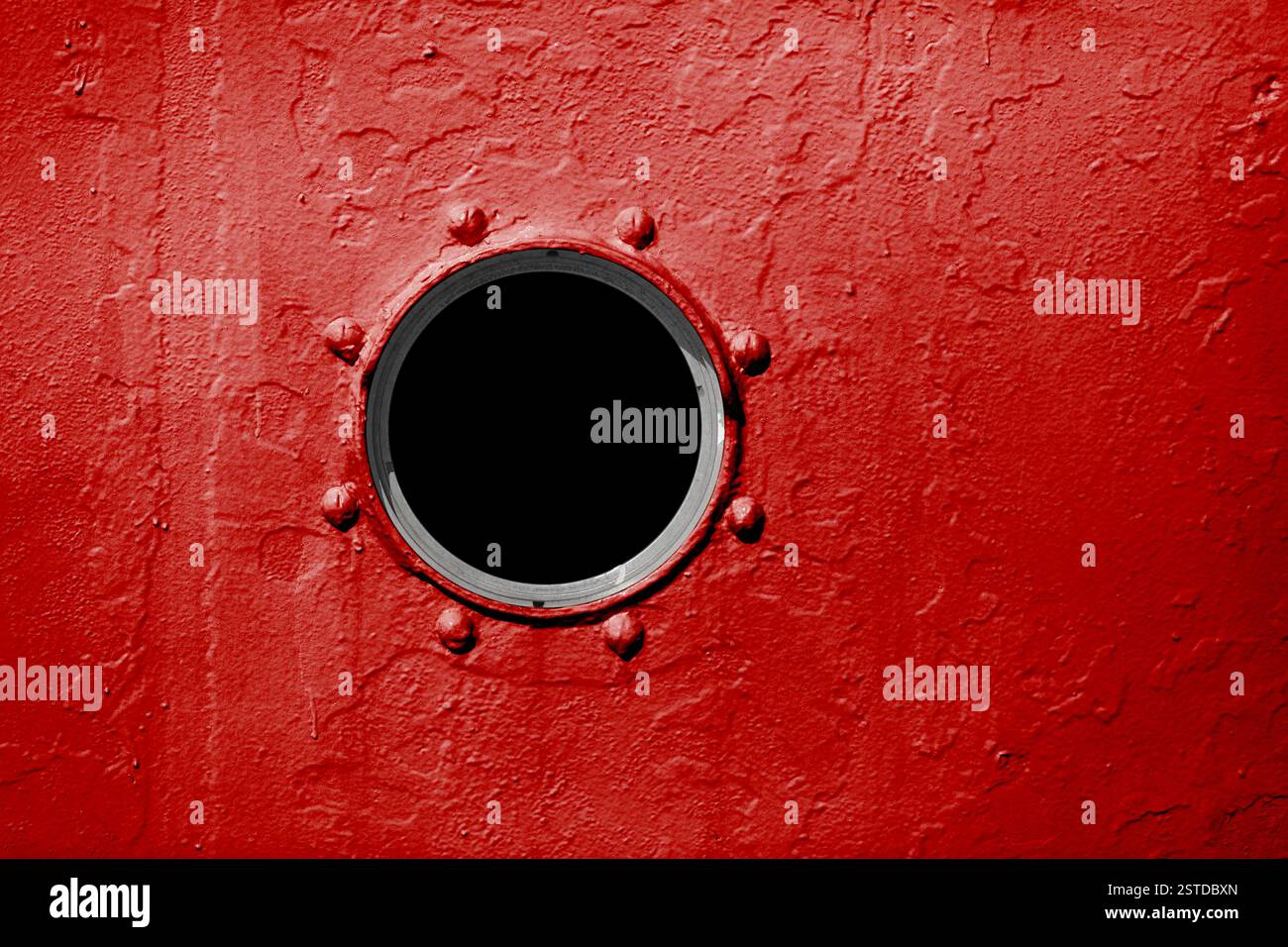 Porthole on the red wall of the old ship Stock Photo - Alamy