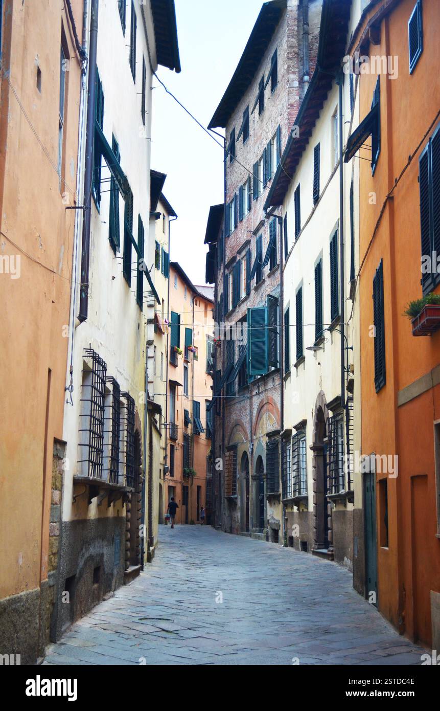 Narrow old urban street in italian town Stock Photo - Alamy