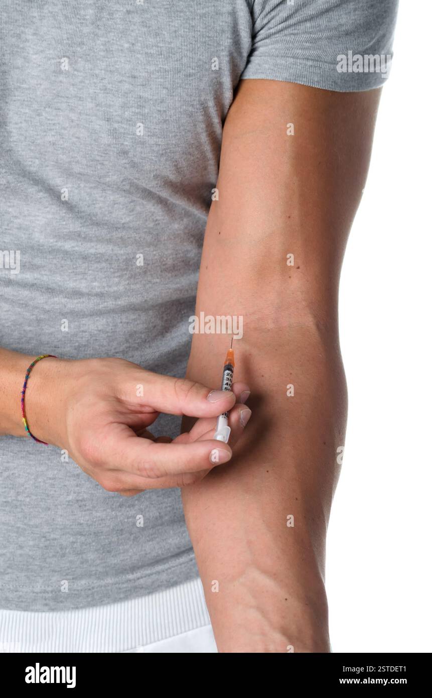 Injecting needle in arm hi-res stock photography and images - Alamy