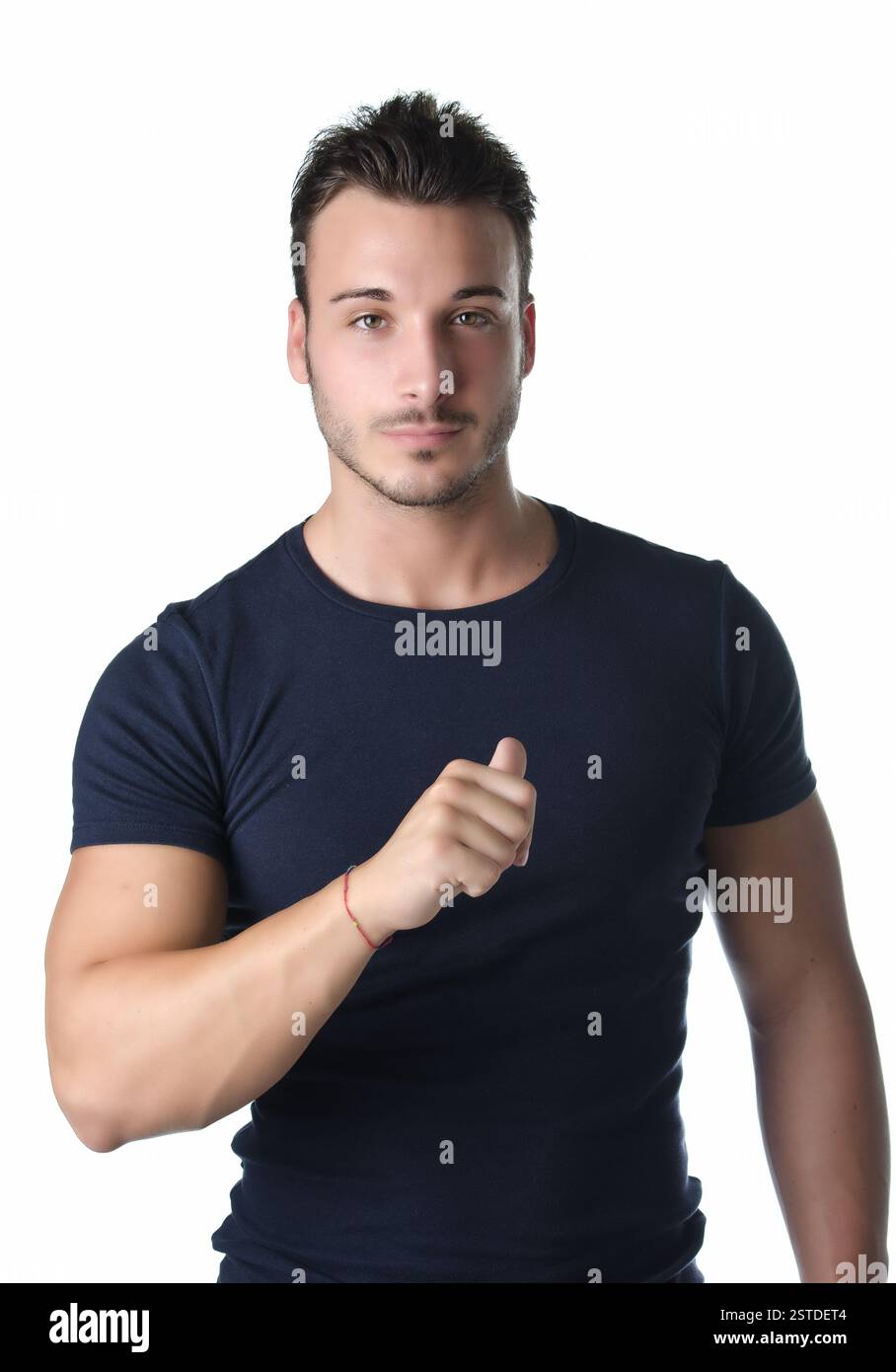 Handsome young man pointing thumb finger at himself Stock Photo - Alamy