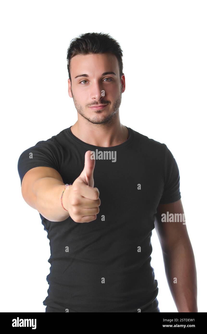 Attractive muscular young man with thumb up doing ok sign hi-res stock ...