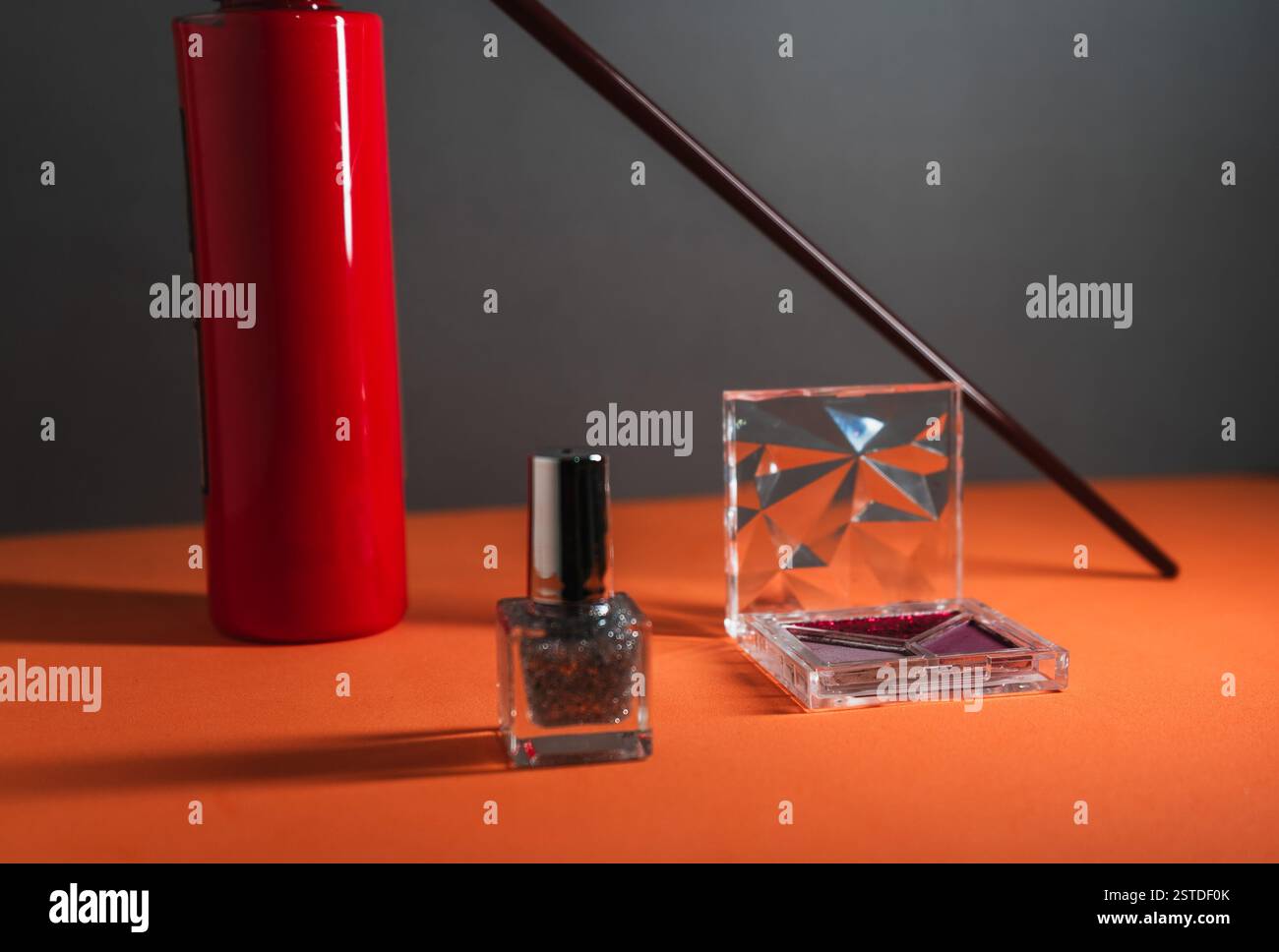 Colorful nail polish and cosmetics on a vibrant surface with stylish ...