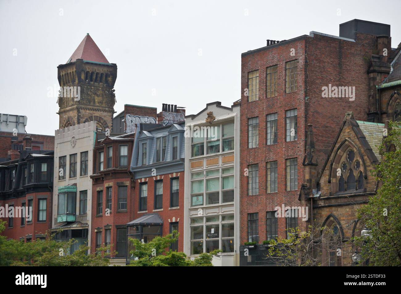 Boston: A row of colorful brick buildings lines the street ...