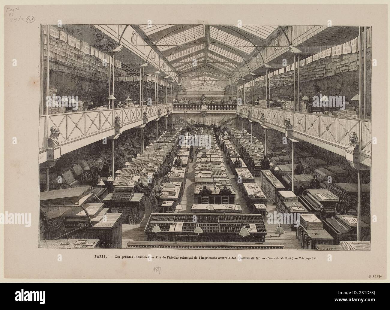 Inside a printing workshop, typographers work on a mechanical press ...