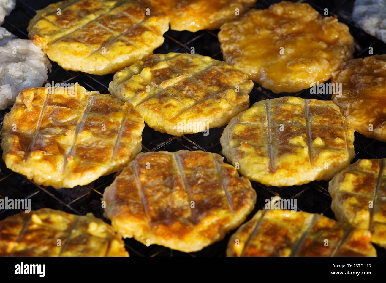 Rice cakes fried on coals open market in thailand hi-res stock ...