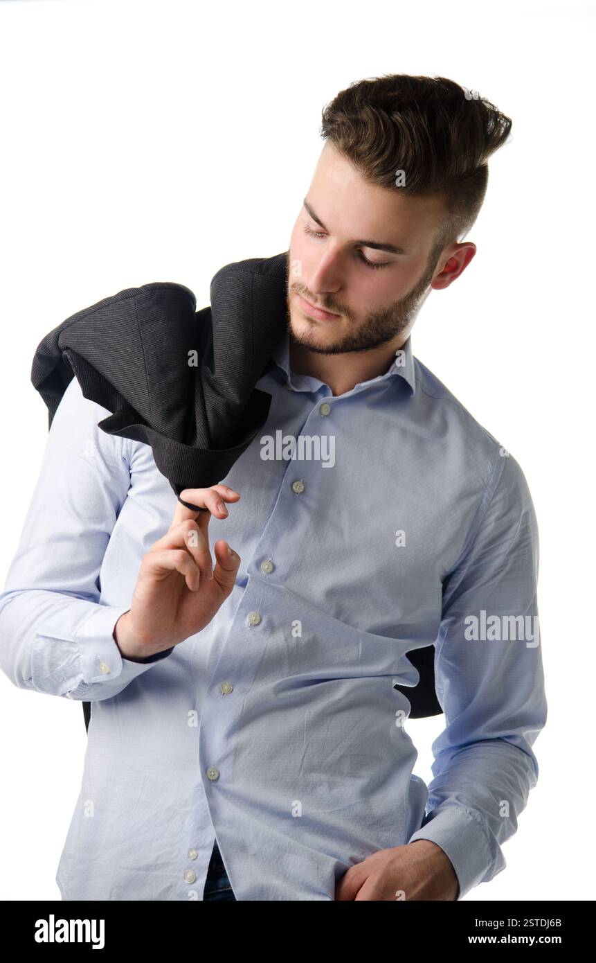 Portrait of handsome young business man on white background holding ...