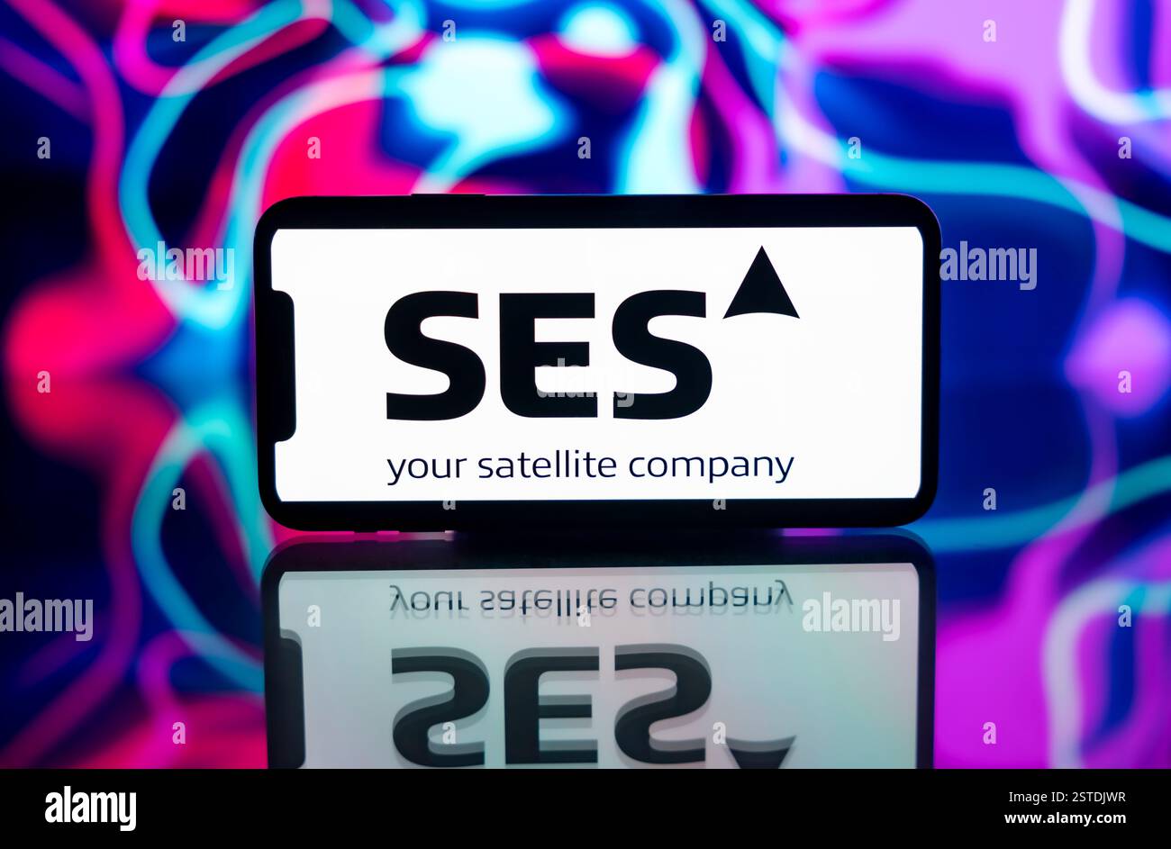 In this photo illustration, the SES logo is seen displayed on a mobile ...