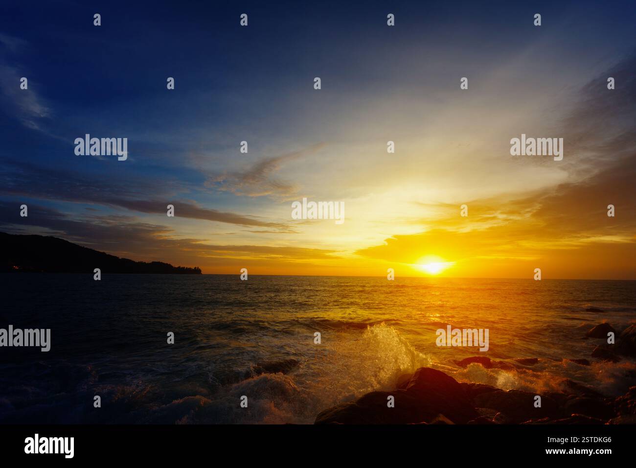 The dazzling bright sunset over a tropical ocean. Thailand Stock Photo ...