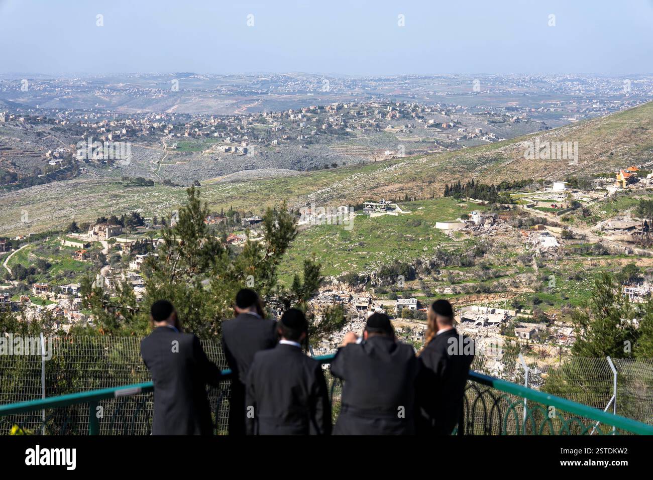 Ultra-Orthodox Jewish men look from Kibbutz Misgav Am in northern ...